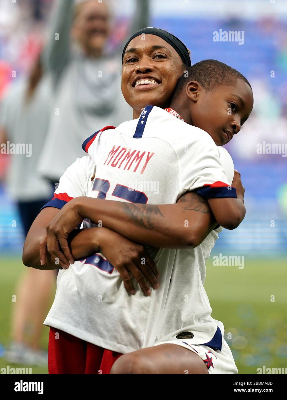 USA's Jessica McDonald celebrates with her son Jeremiah after the game ...