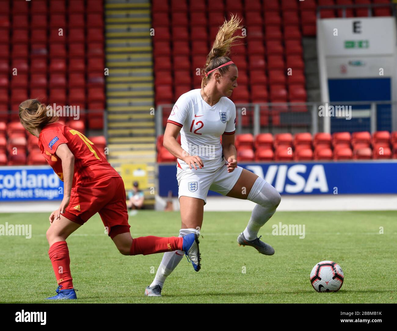 Belgium's Janne Geers and England's Ella Rutherford battle for the ball ...