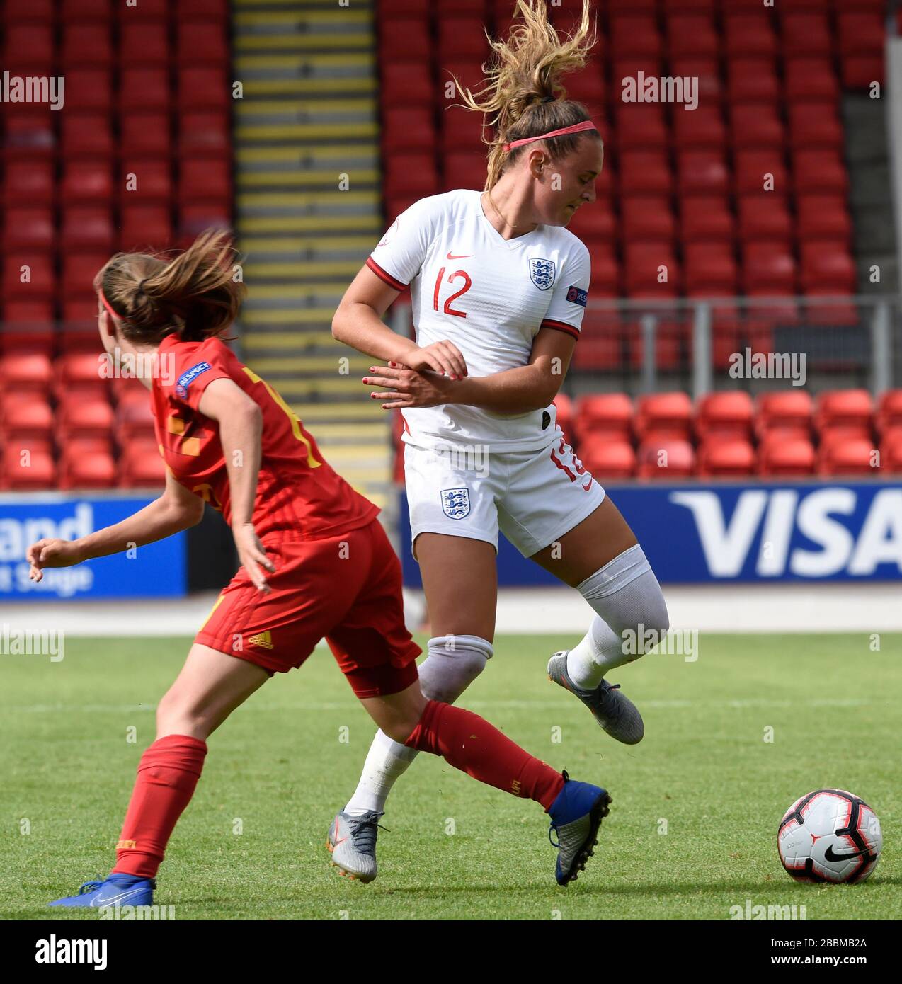 Belgium's Janne Geers and England's Ella Rutherford battle for the ball ...