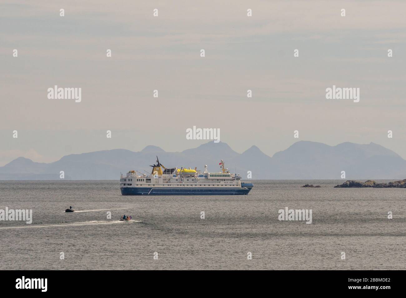 Cruise Ship Ocean Nova at anchor at the mouth of Loch Boisdale with the ...