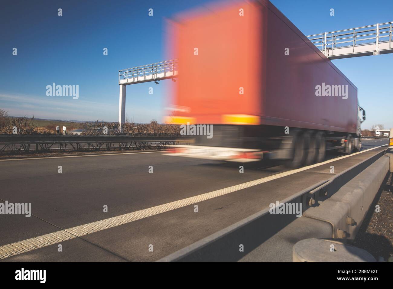 Truck passing through a toll gate on a highway, highway charges, motion ...