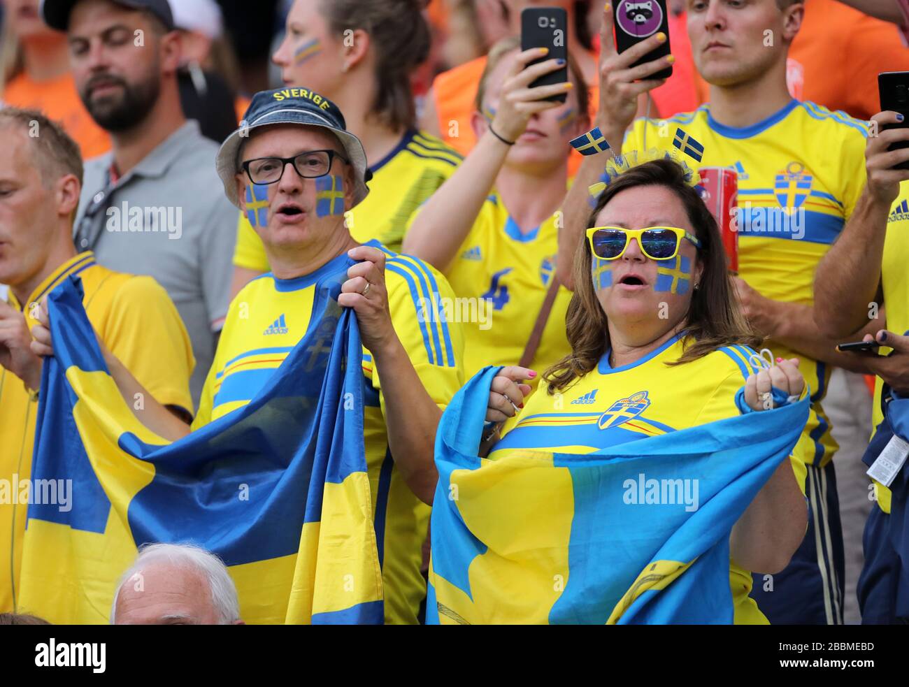Sweden fans in the stands Stock Photo - Alamy