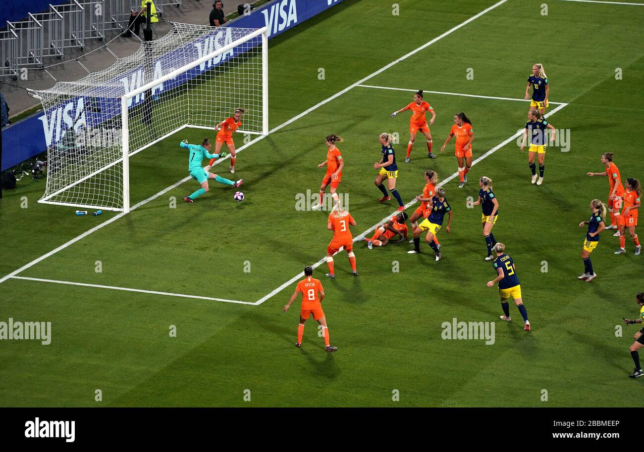 Netherlands goalkeeper Sari van Veenendaal (left) makes a save Stock ...