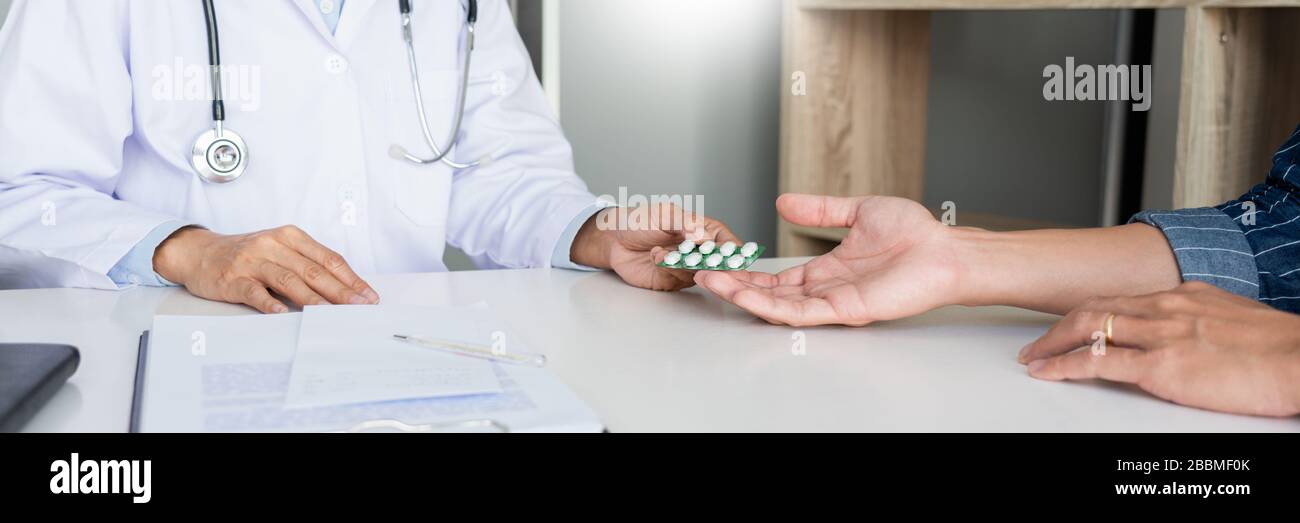 health care concept, doctor give a medicine drugs pills and explain the ...