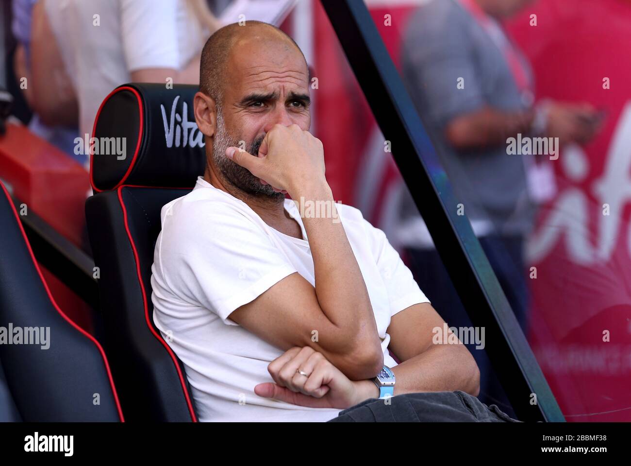 Manchester City manager Pep Guardiola on the bench before the match ...