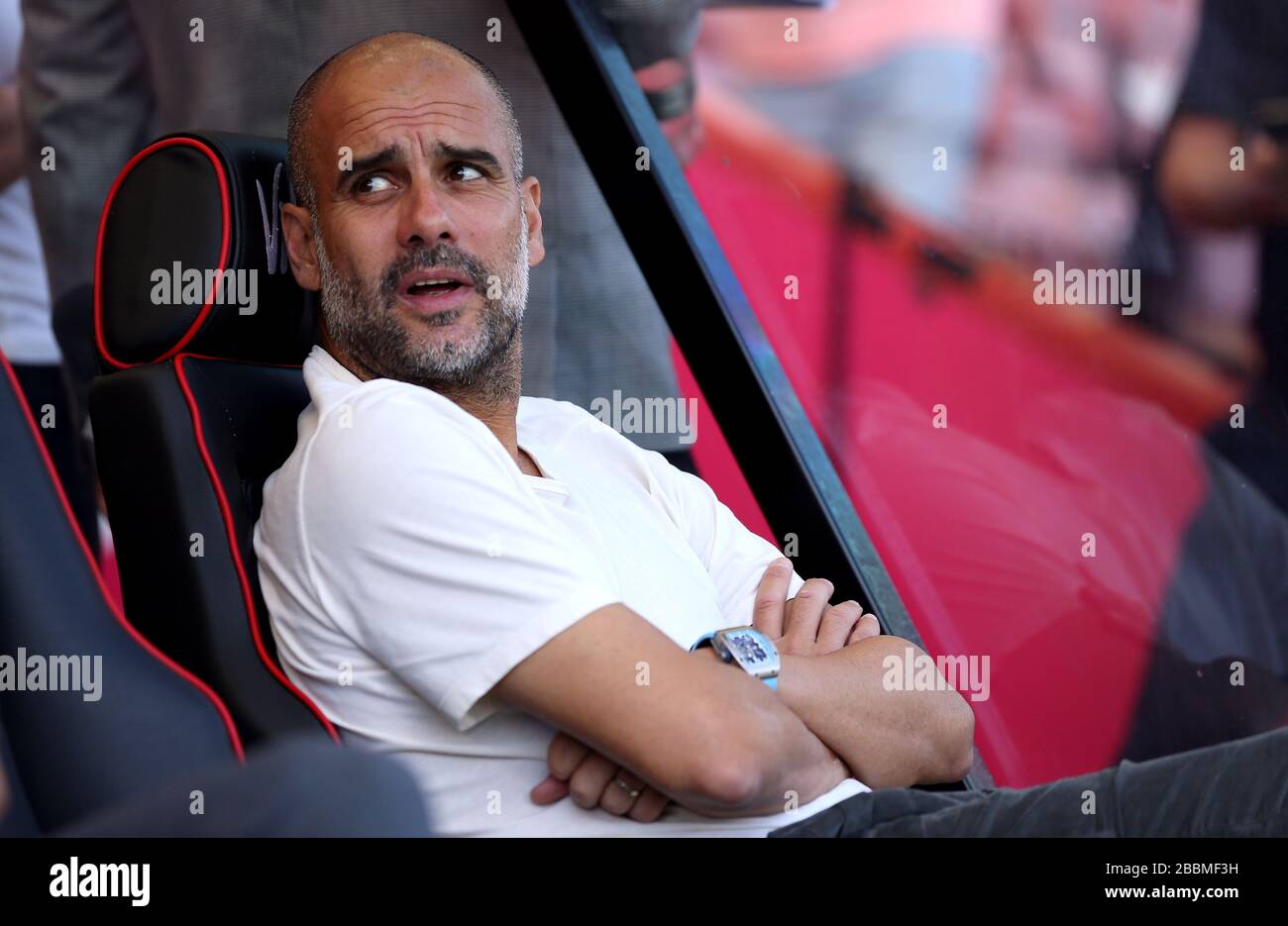 Manchester City manager Pep Guardiola on the bench before the match ...