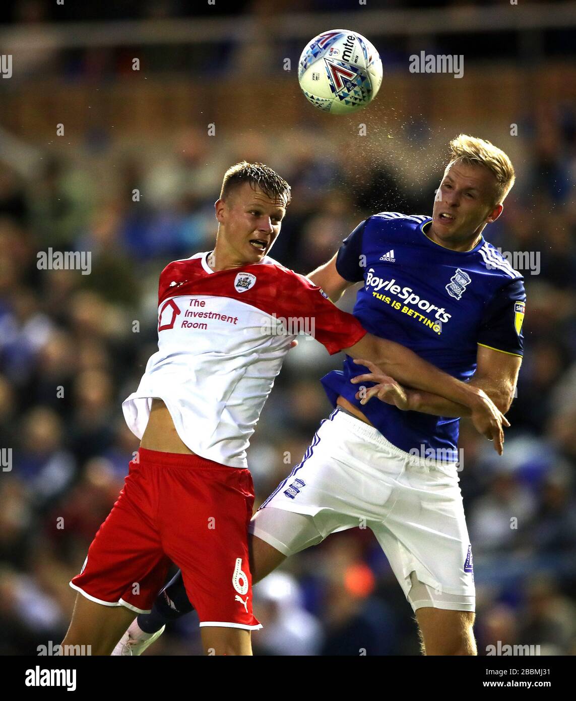 Barnsley's Mads Andersen (left) and Birmingham City's Marc Roberts ...