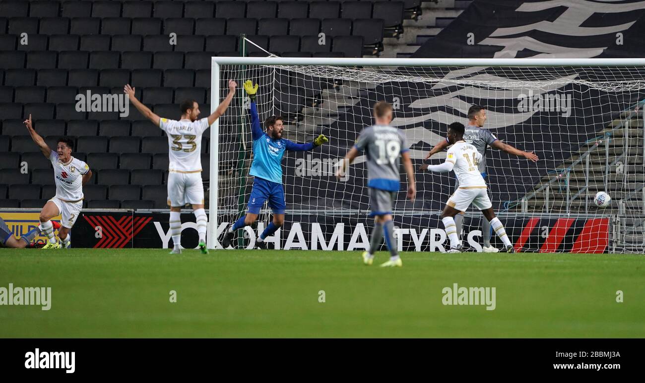 Milton Keynes Dons' George Williams celebrate scoring his side's second ...