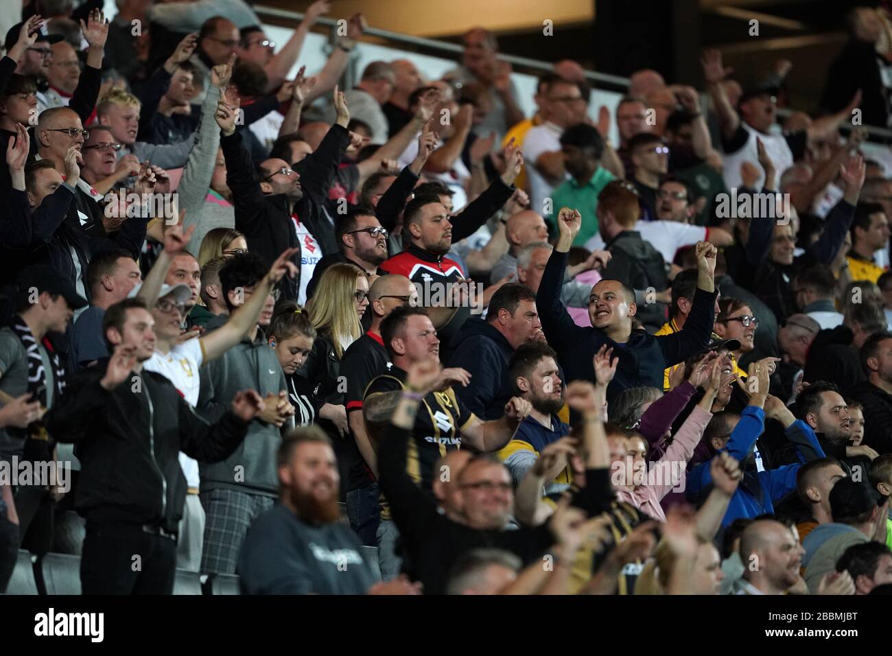 Milton Keynes Dons' fans celebrate winning the game Stock Photo - Alamy