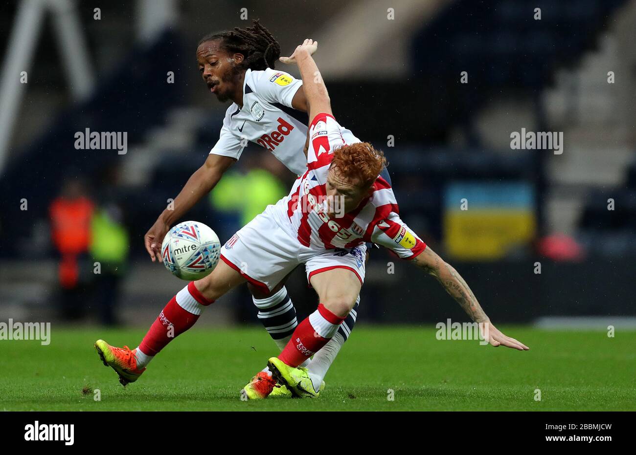 Preston North End's Daniel Johnson (left) and Stoke City's Ryan Woods ...