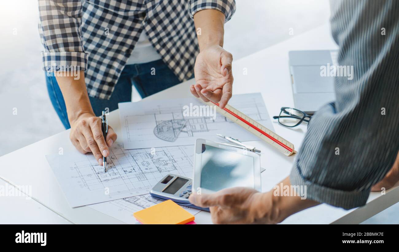 engineer Hand Drawing Plan On Blue Print with architect equipment ...