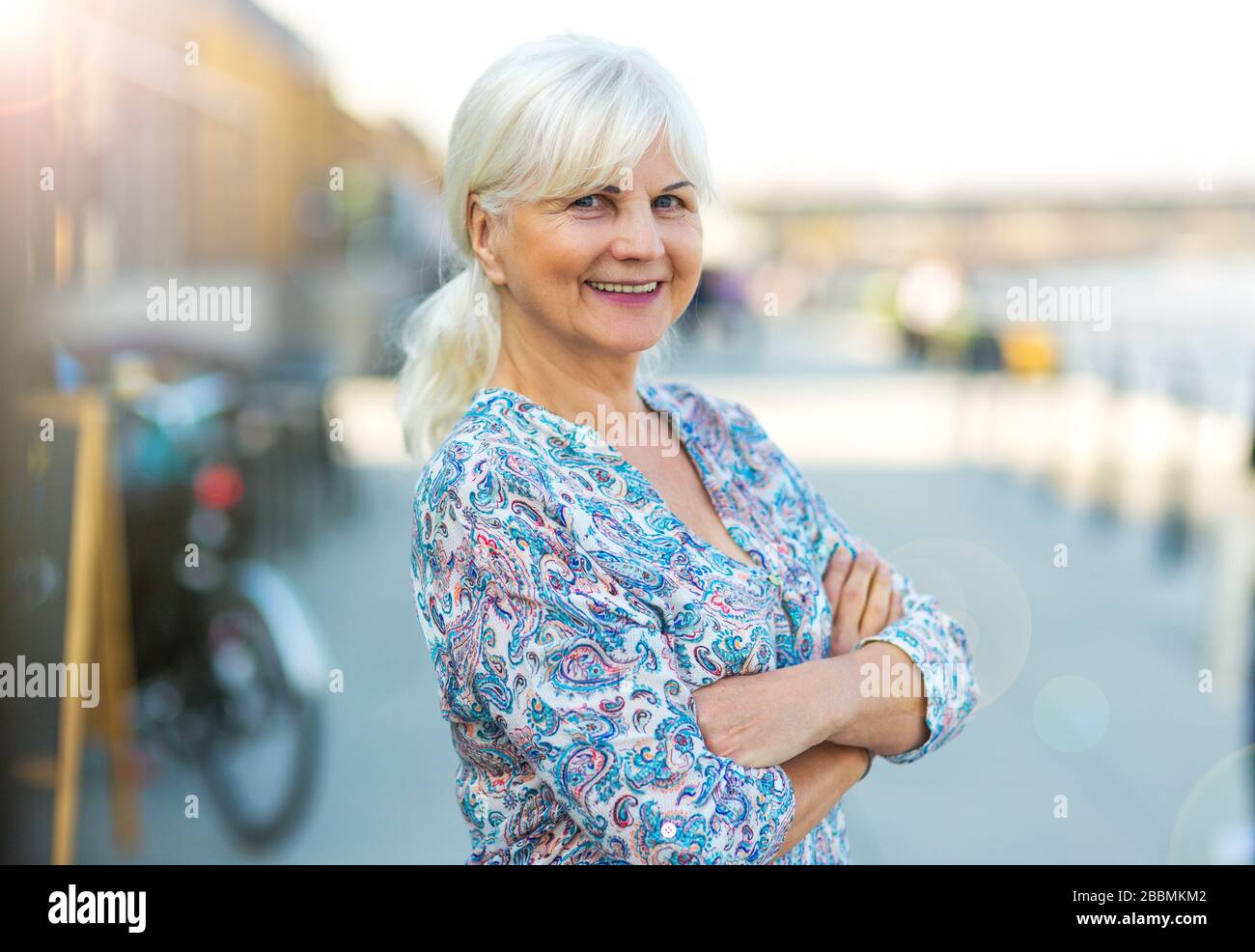 Senior woman standing outdoors Stock Photo - Alamy