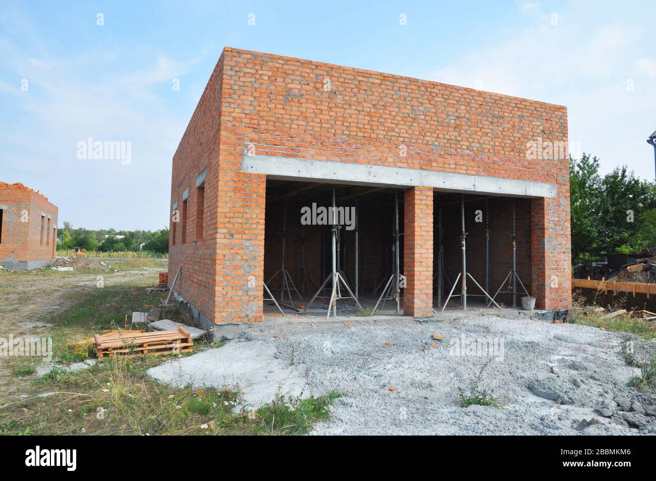 Garage under construction. Building new brick wall garage for two cars ...