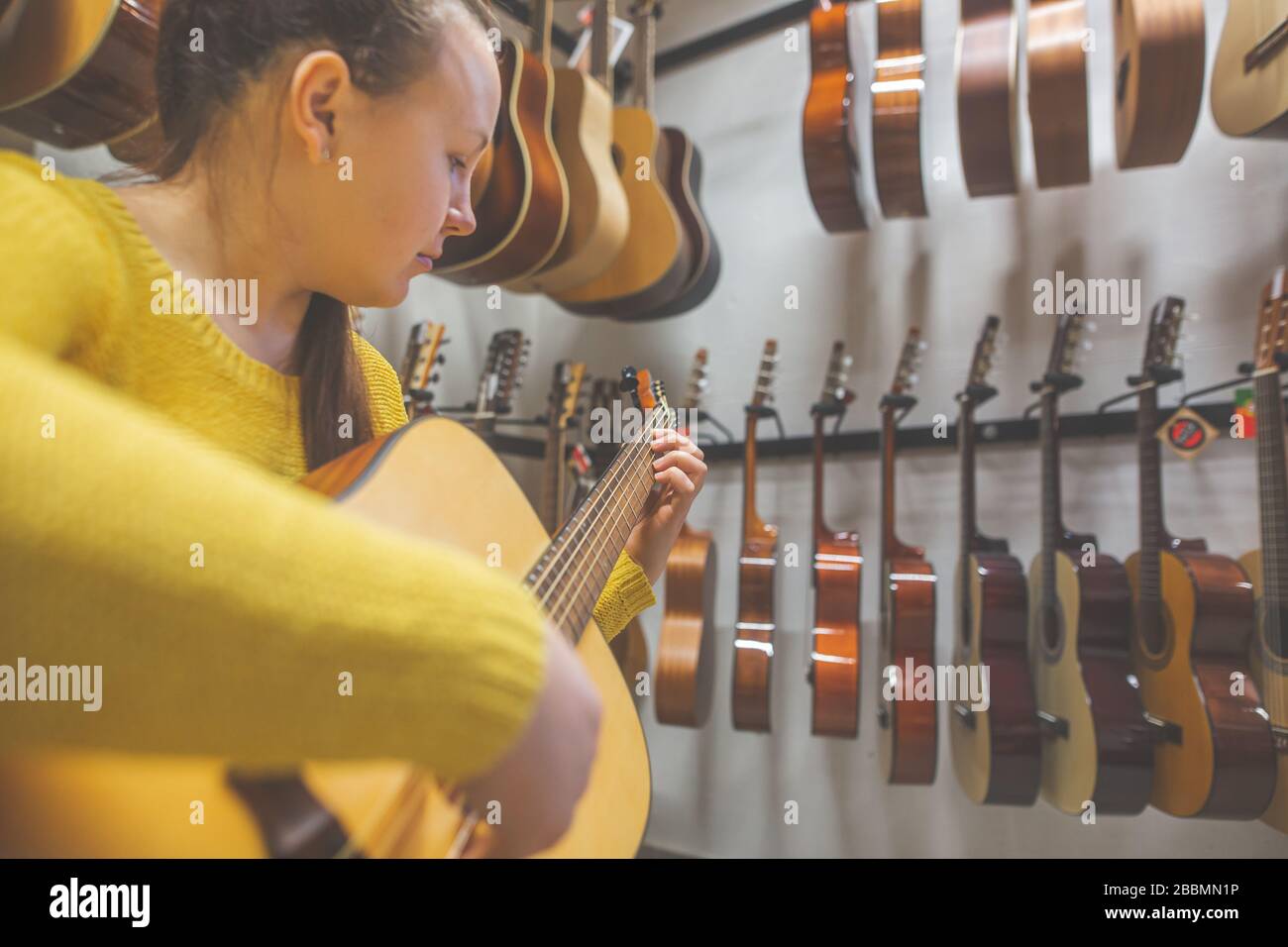 Buying musical instruments hi-res stock photography and images - Alamy
