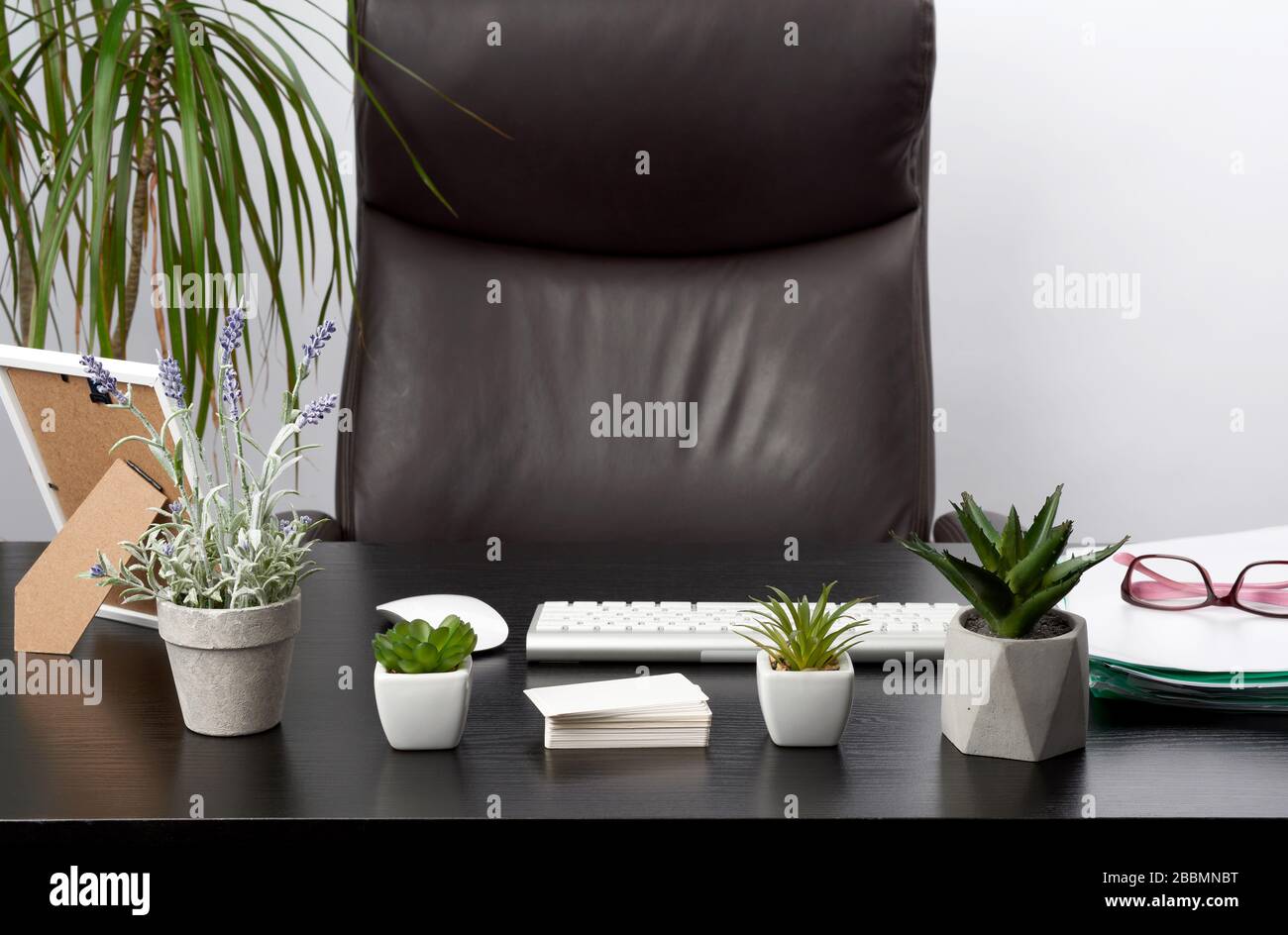 black table with stationery, wireless keyboard, mouse, workplace of a ...
