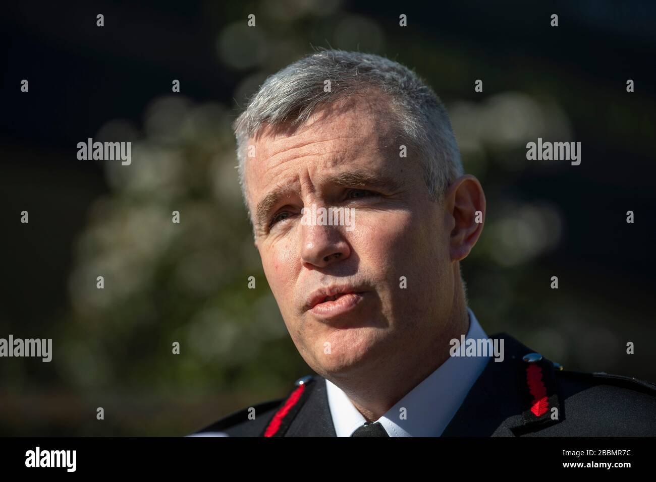 Andy Roe, Commissioner of the London Fire Brigade, as fire fighters ...