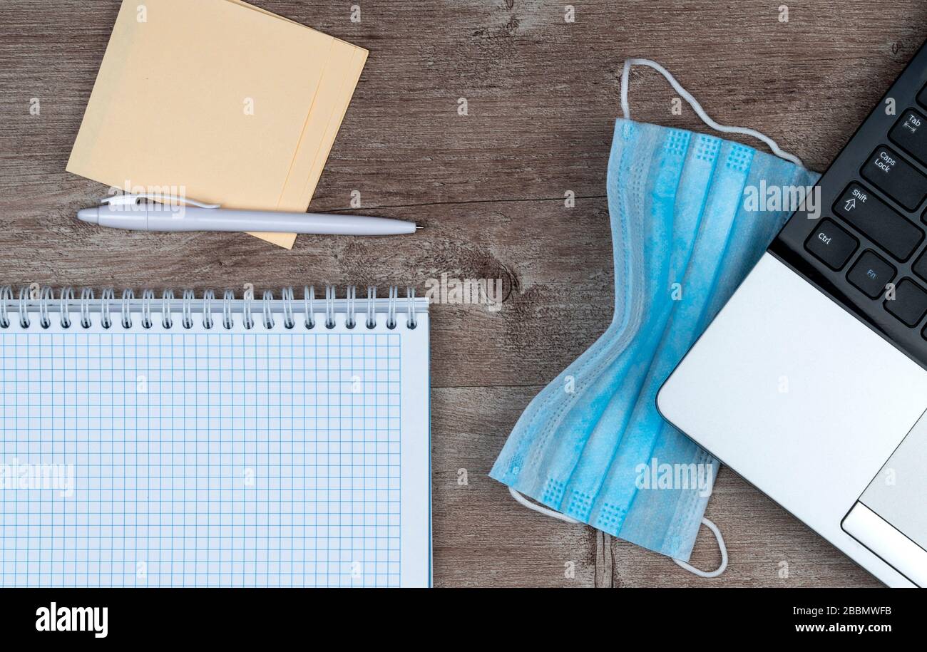 hygiene in the office. remote work kit on wooden desk. sanitizer gel ...