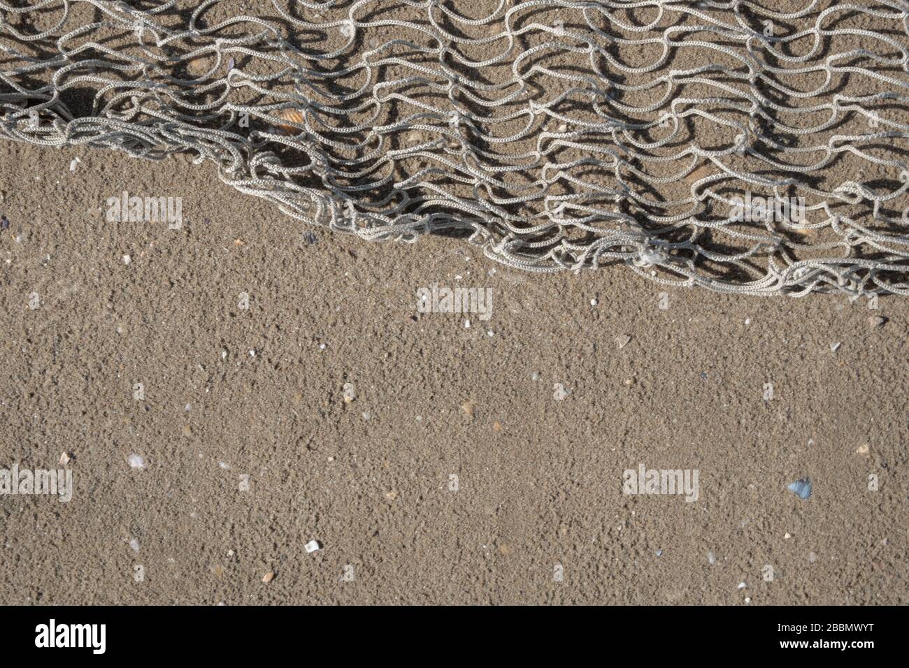 White net on the sand Stock Photo - Alamy