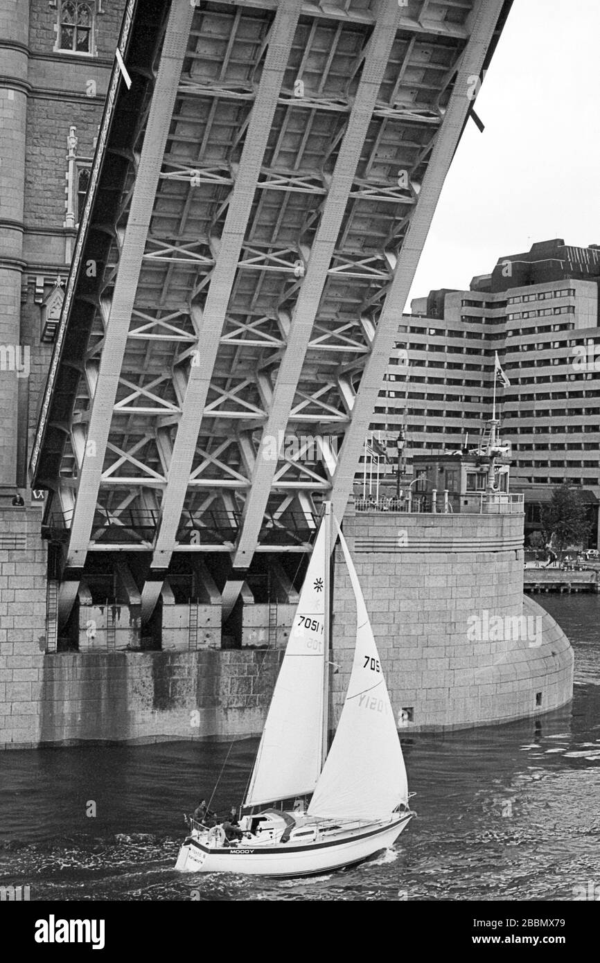 Yacht under sail and power (Moody 29 "Foxee B"), sails under the raised ...