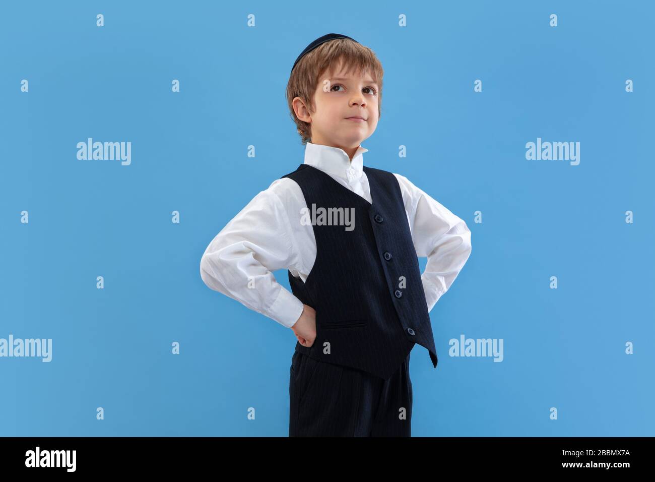 Posing confident, cute. Portrait of a young orthodox jewish boy ...