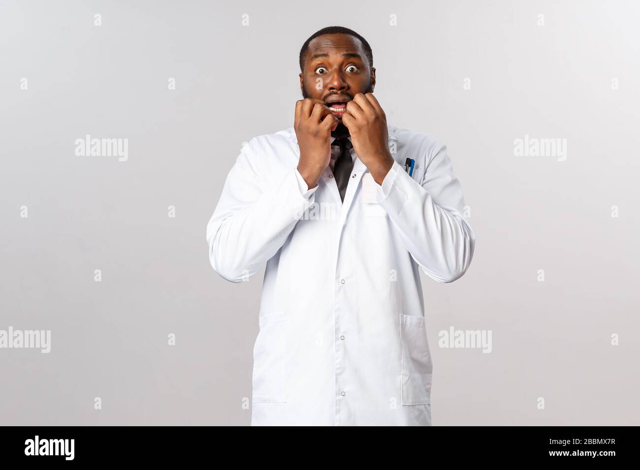 Portrait of scared, embarrassed african-american man gasping and look ...