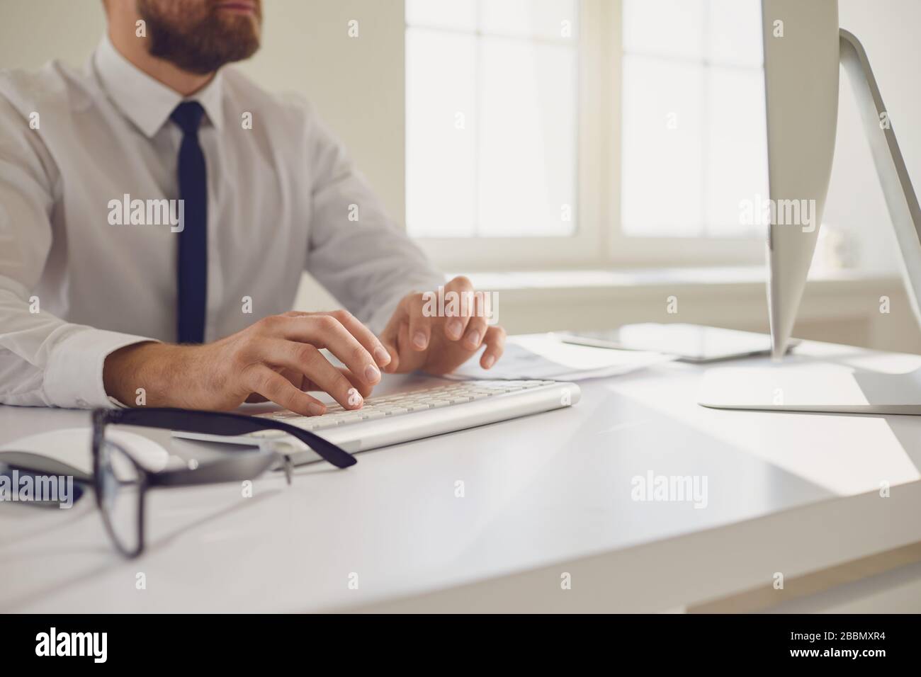 Work training online. Male hands of businessman tipping using keyboard ...