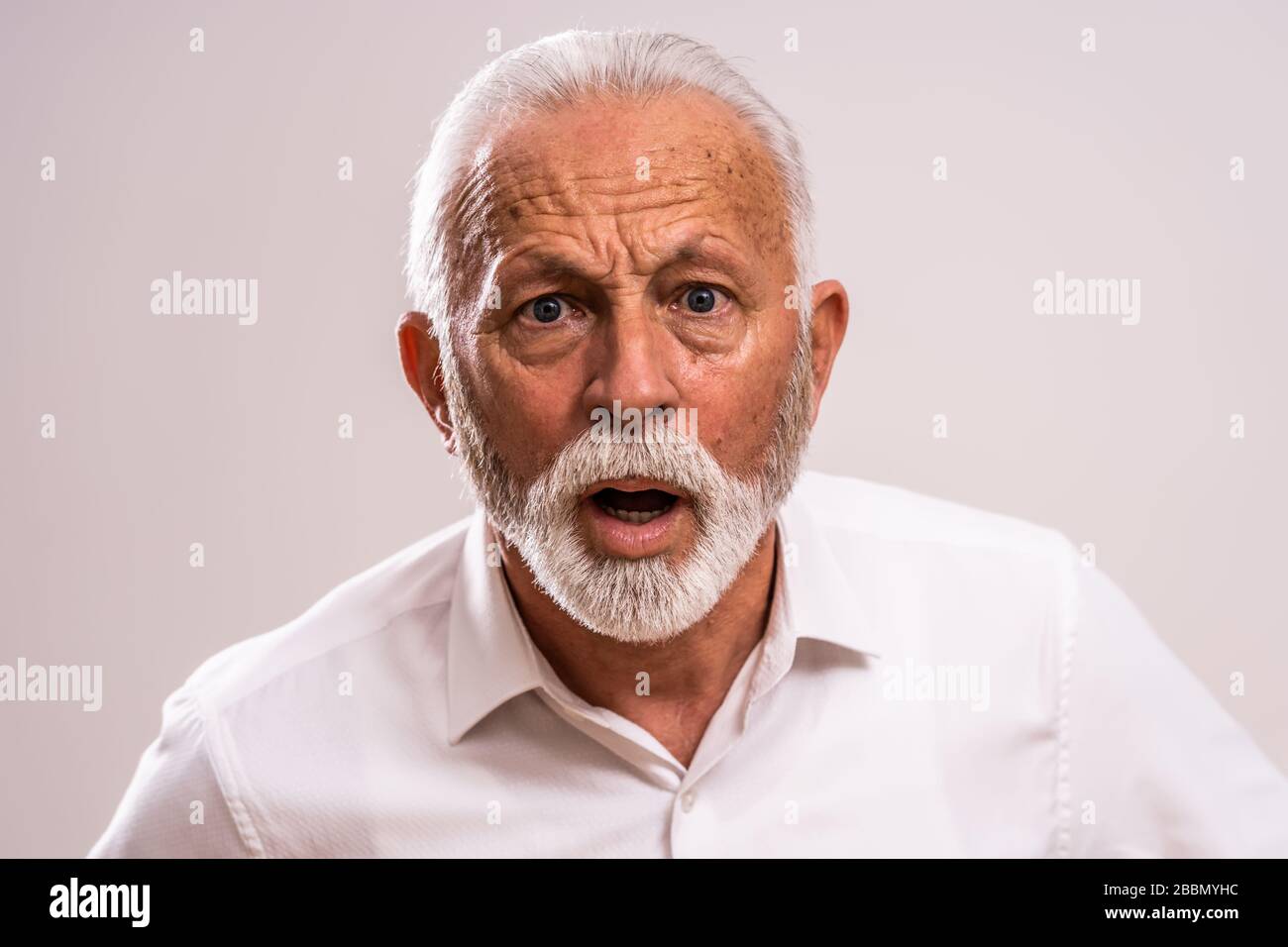 Portrait of surprised and shocked senior man Stock Photo - Alamy
