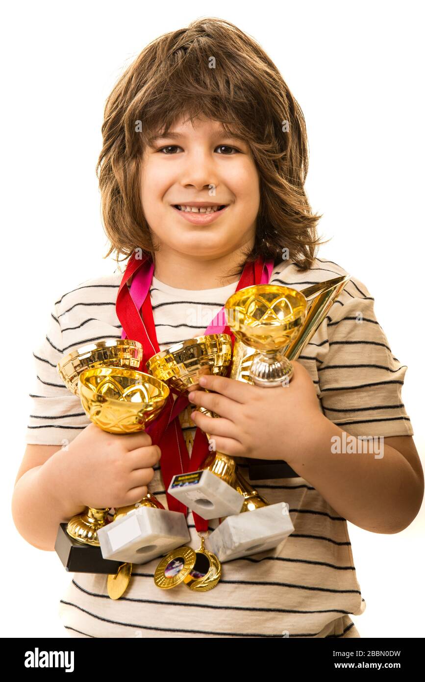 Champion happy boy with many cups isolated on white background Stock ...