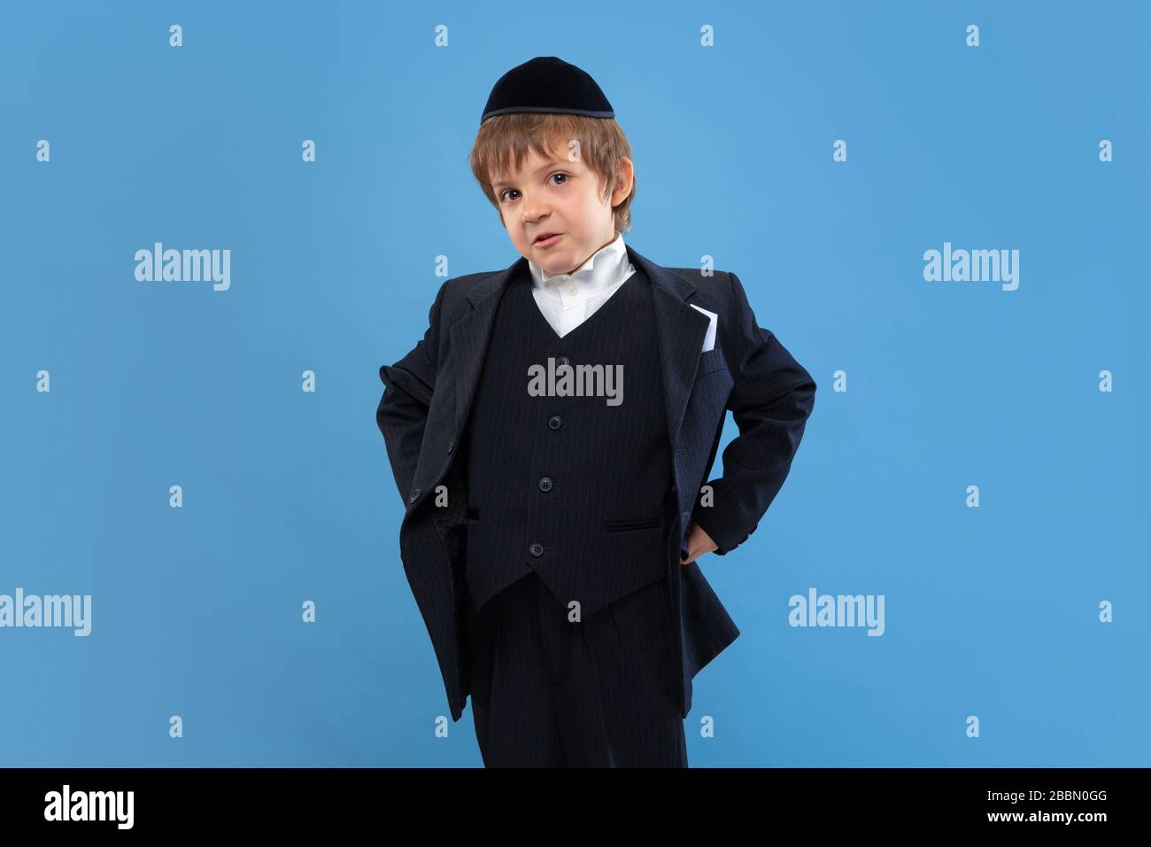 Posing confident, cute. Portrait of a young orthodox jewish boy ...