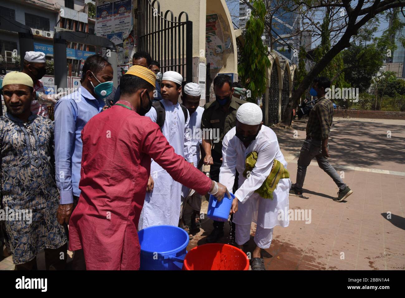 People washing hands with anti-bacterial soap as a precautionary step ...