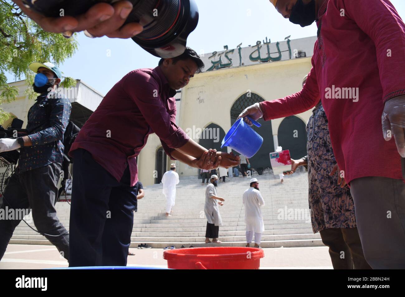 People washing hands with anti-bacterial soap as a precautionary step ...