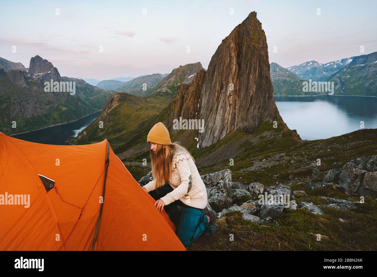 Tent camping in mountains hiker woman traveling in Norway alone ...