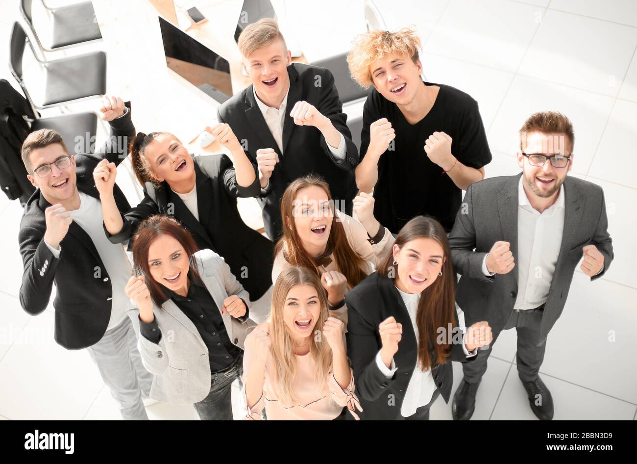 top view. a large group of young employees showing their success Stock ...