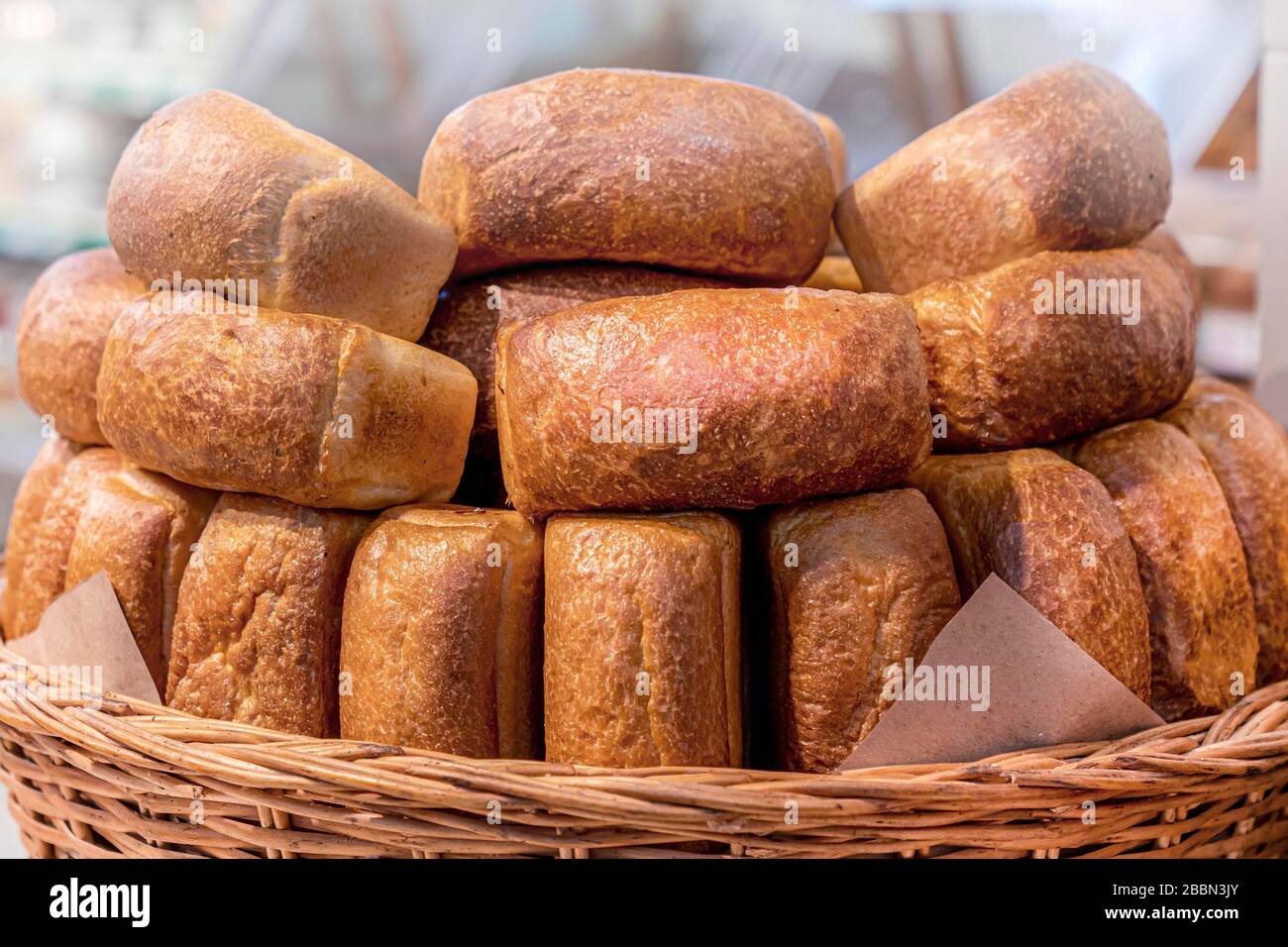 many loaves of bread in a wicker basket, close-up Stock Photo - Alamy
