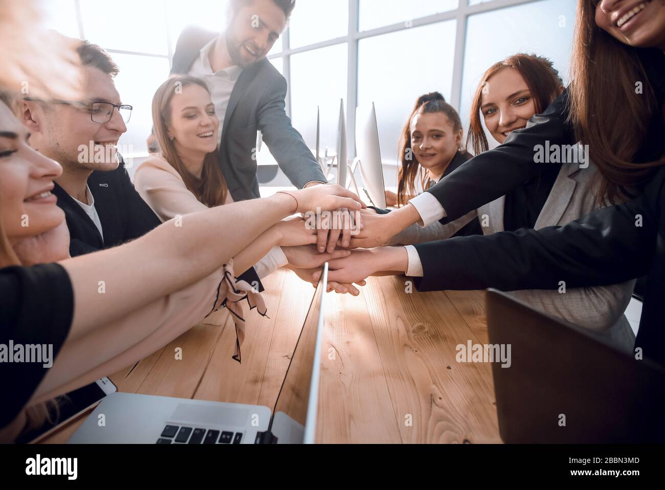 close up. a group of young employees showing their unity Stock Photo ...