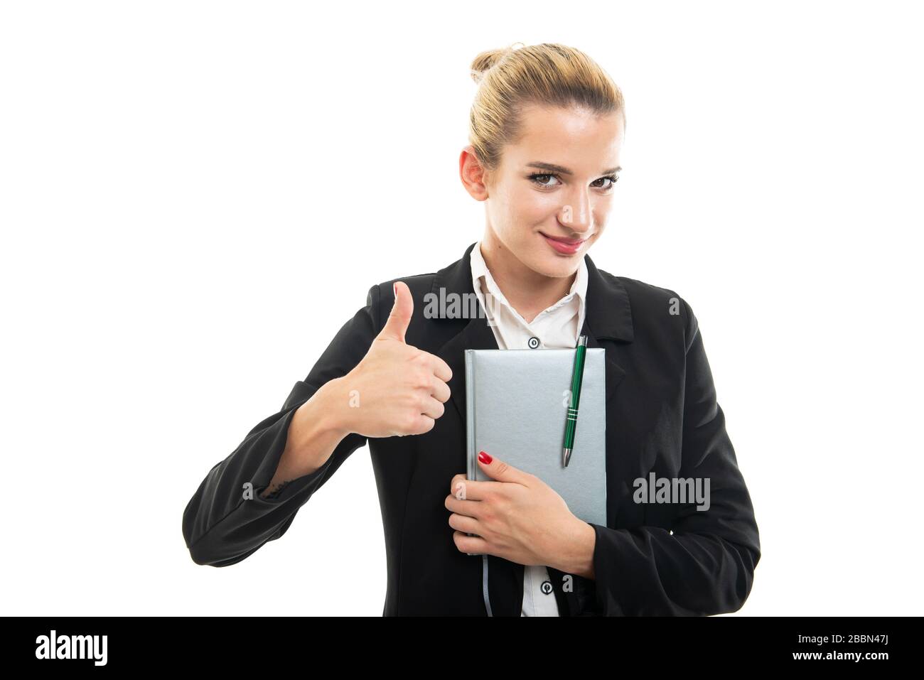 Young female assistant manager holding agenda showing like gesture ...