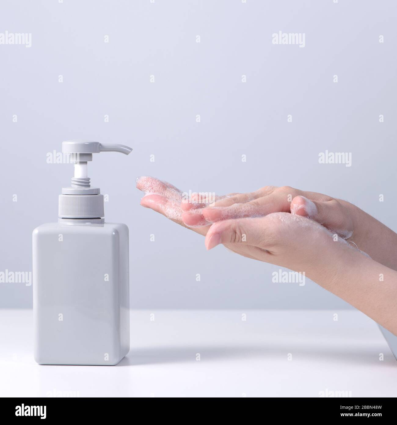 Hand washing. Asian young woman using soap to wash hands, concept of ...