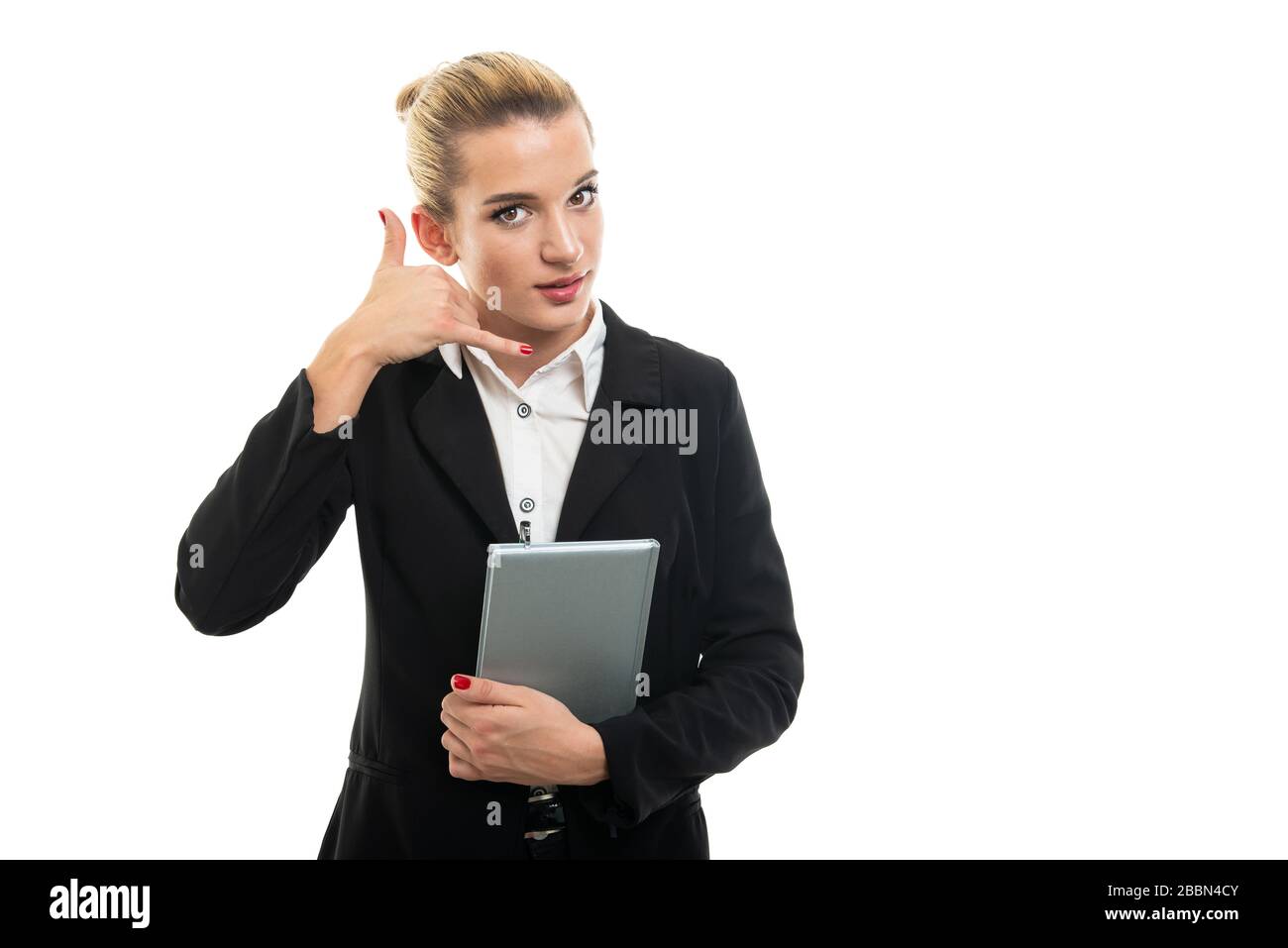 Young female assistant manager holding agenda making calling gesture ...