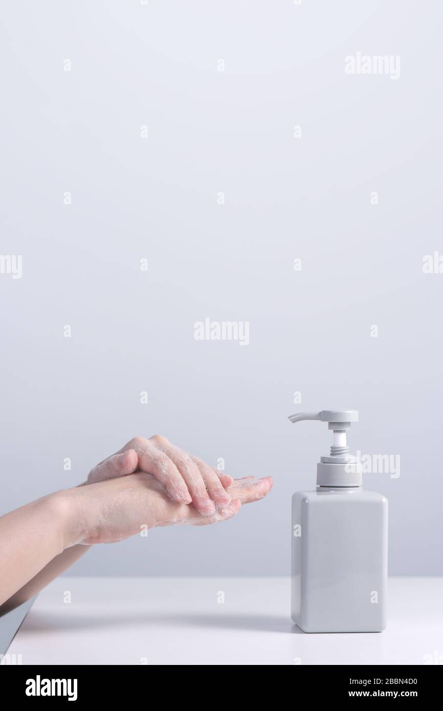 Hand washing. Asian young woman using soap to wash hands, concept of ...