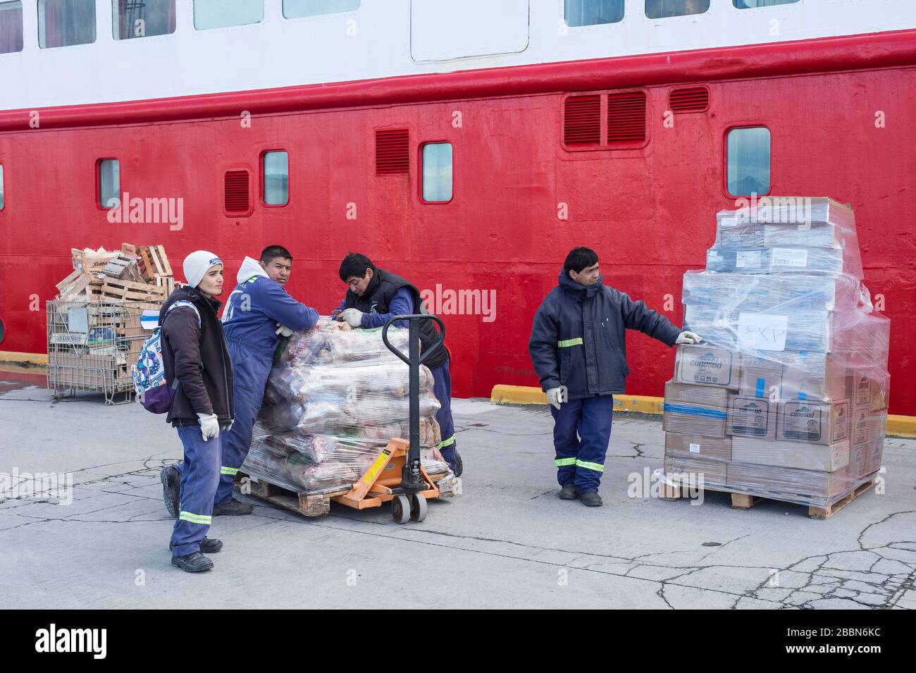 Loading supplies onto the G Expedition Cruise ship on the dockside in ...
