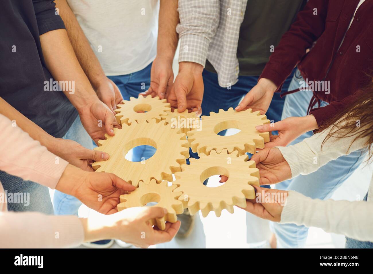 Groups of young people hold gear hands Stock Photo - Alamy