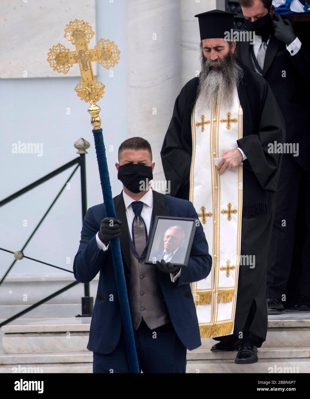 Athens, Greece. 1st Apr., 2020. A casket bearer, wearing black ...