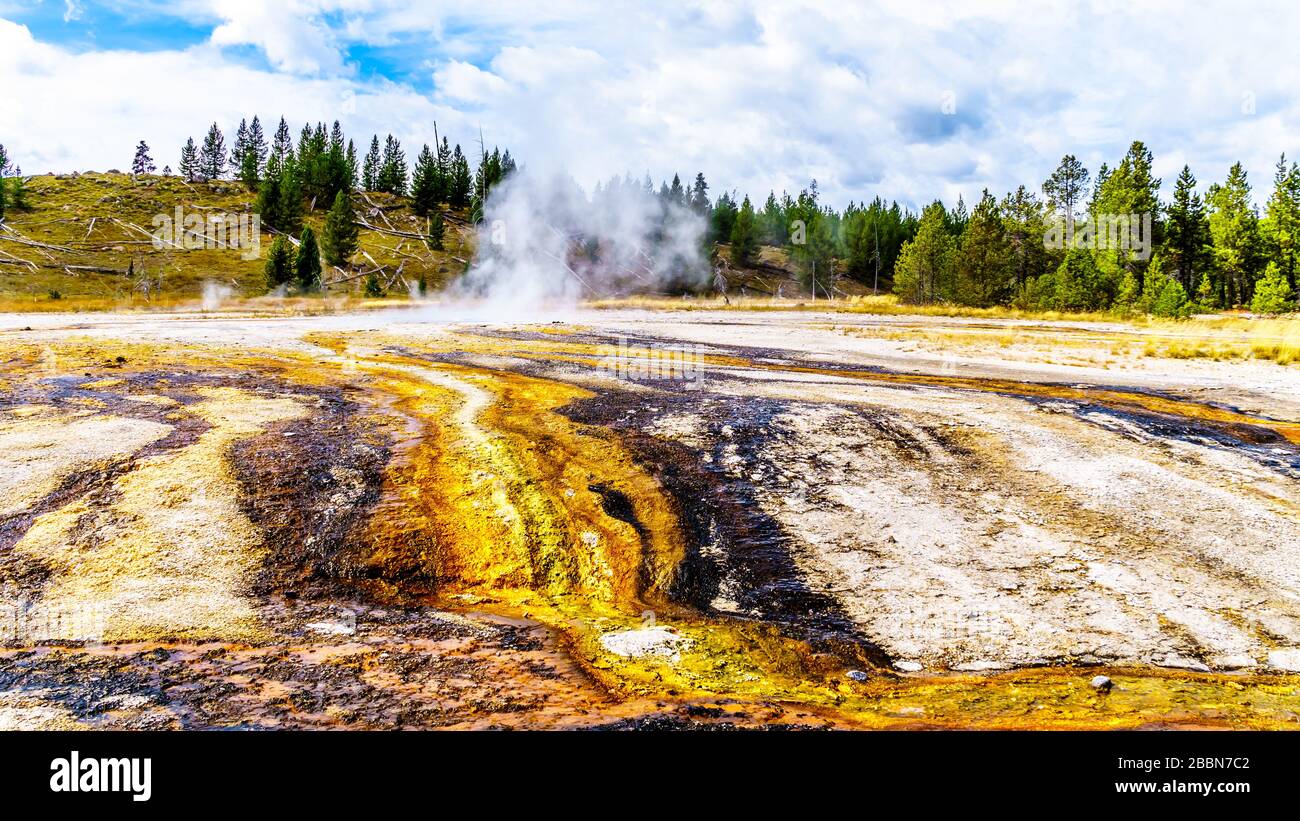 Hot water from the Fan Geyser and several other geysers and hot springs ...