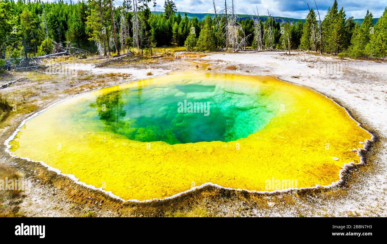 Yellow sulfur mineral deposits around the green and turquoise waters of ...
