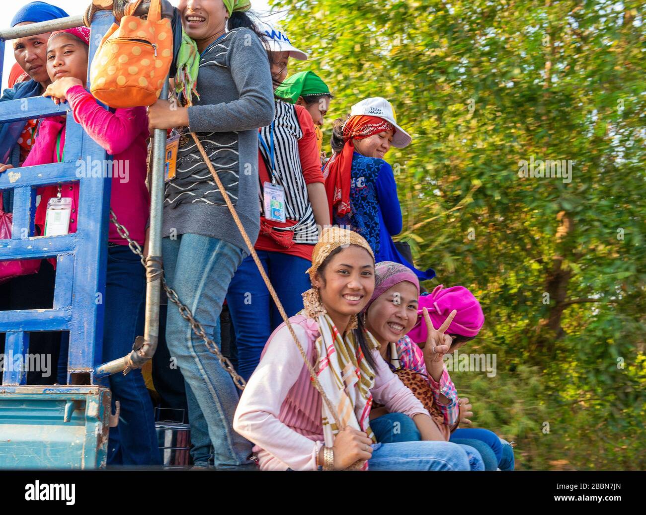 Myanmarese women workers on the back of truck(s) being transported ...