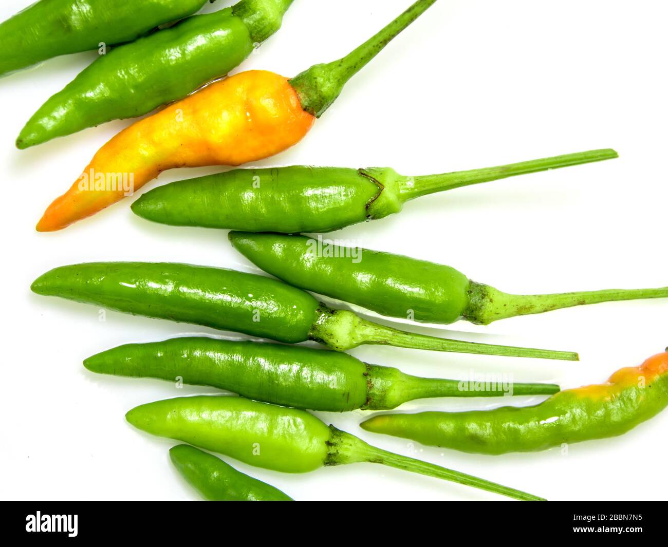 Fresh green and yellow chili isolated on white background Stock Photo ...