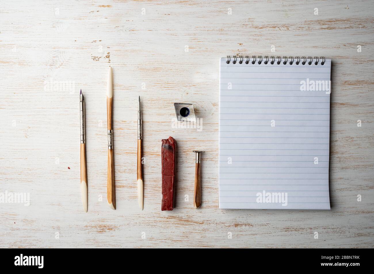 Vintage ink pen, notebook with lines and blue ink, white letter ...