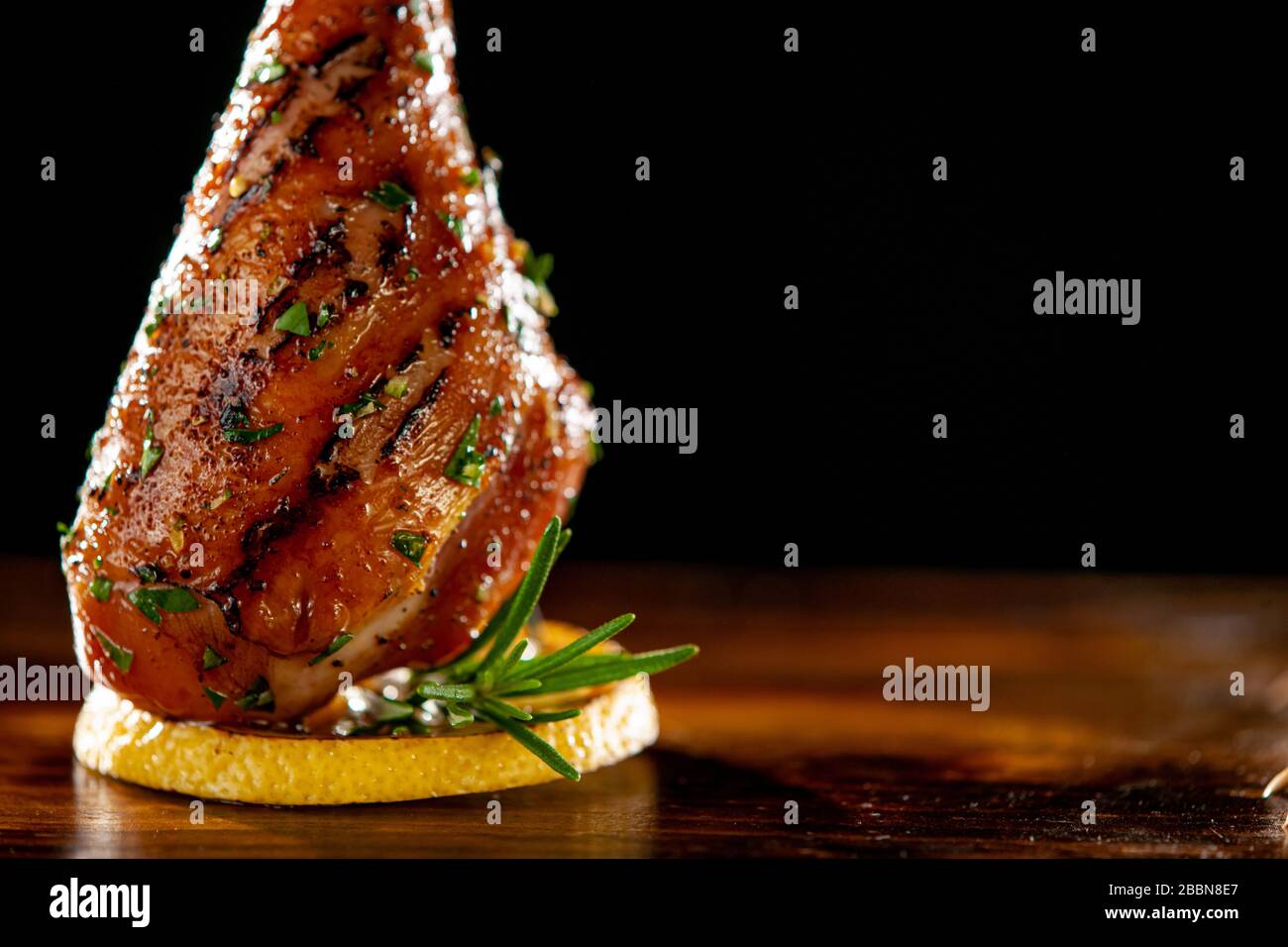 Grilled Chicken Leg decorative presentation Stock Photo - Alamy