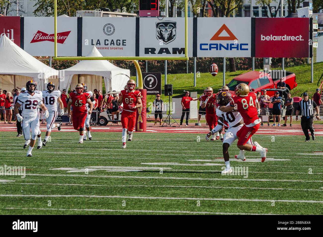 Football ball catch during a university game at the Telus Stadium ...