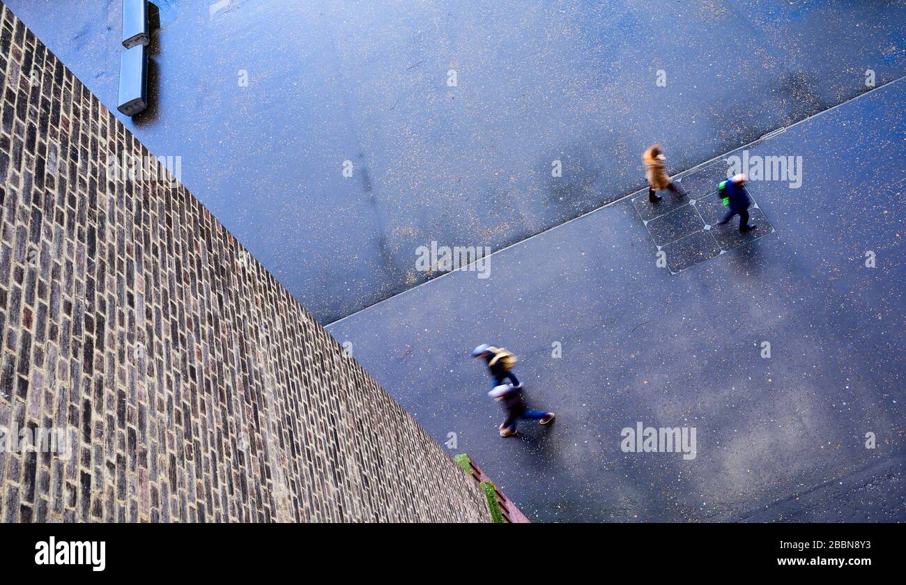 Aerial view of people walking by Stock Photo - Alamy